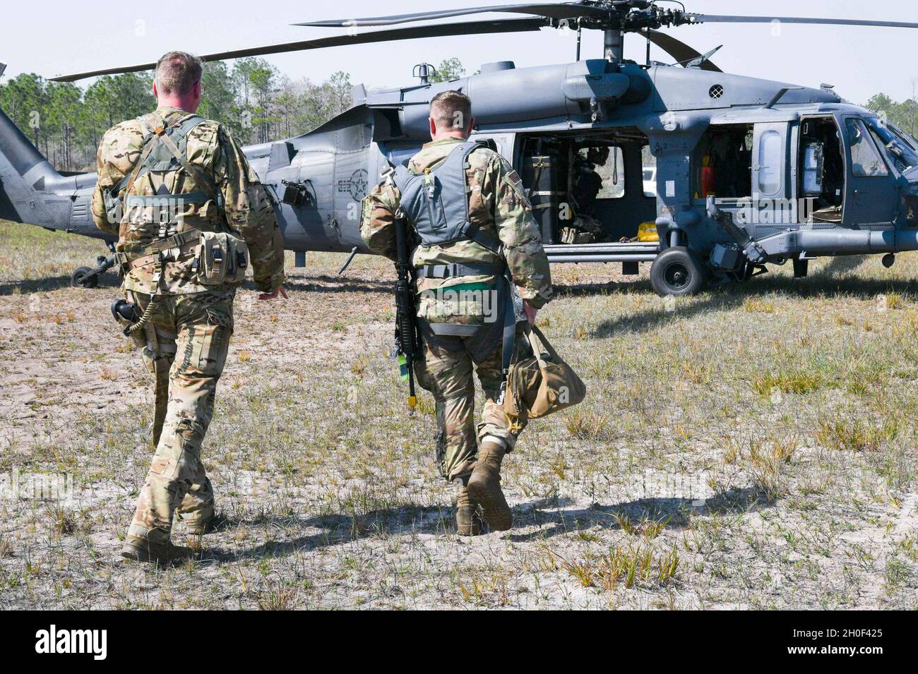 A 920th Aircraft Maintenance Squadron crew chief walks with a 301st ...