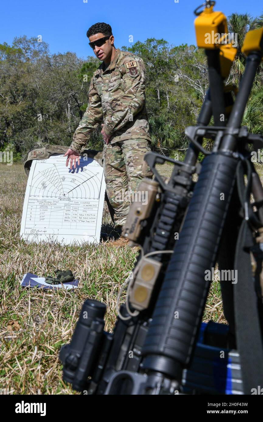 A 920th Security Forces Squadron Airman provides range card instruction ...