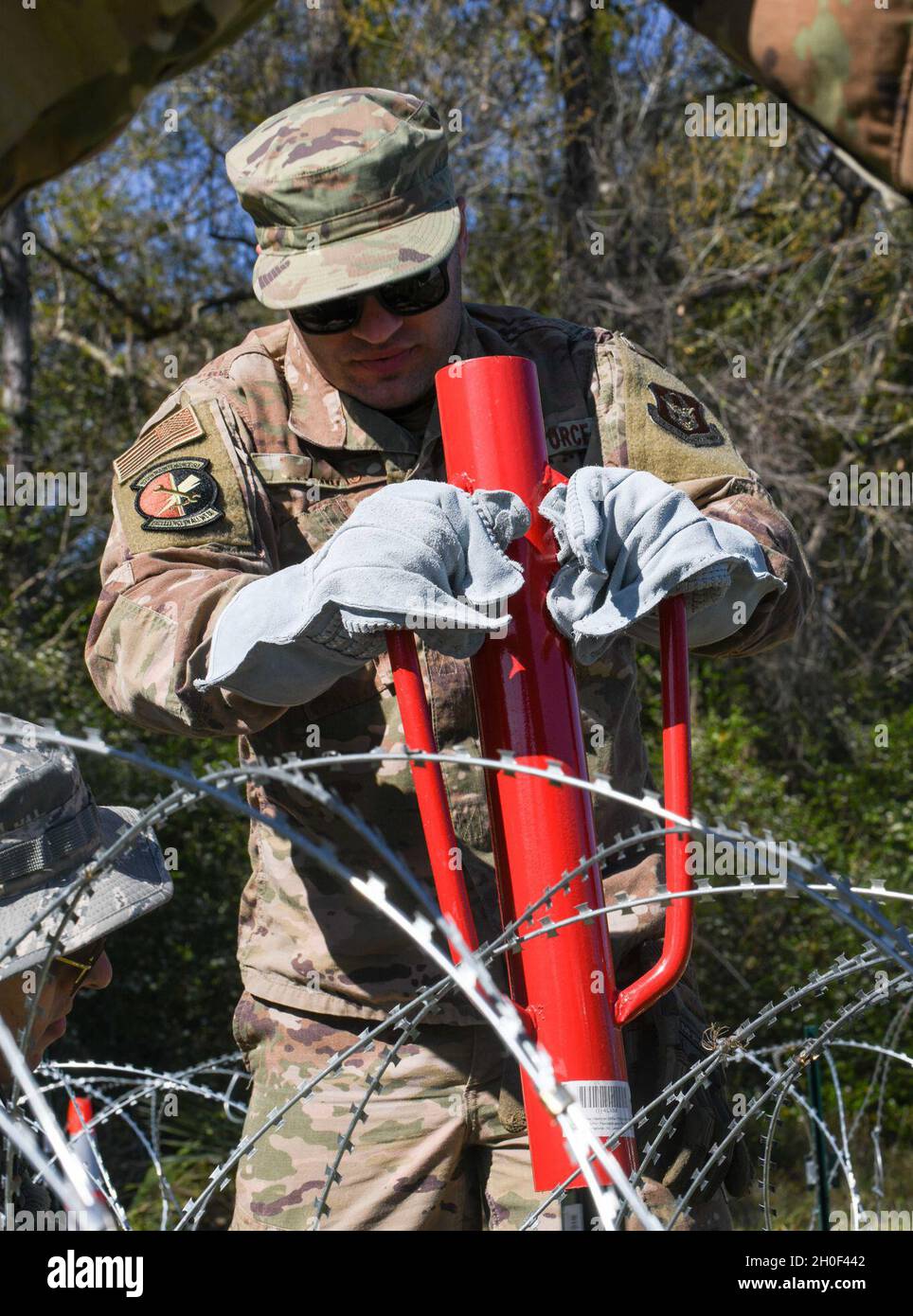 920th Rescue Wing Airmen place concertina Wire during an all ...