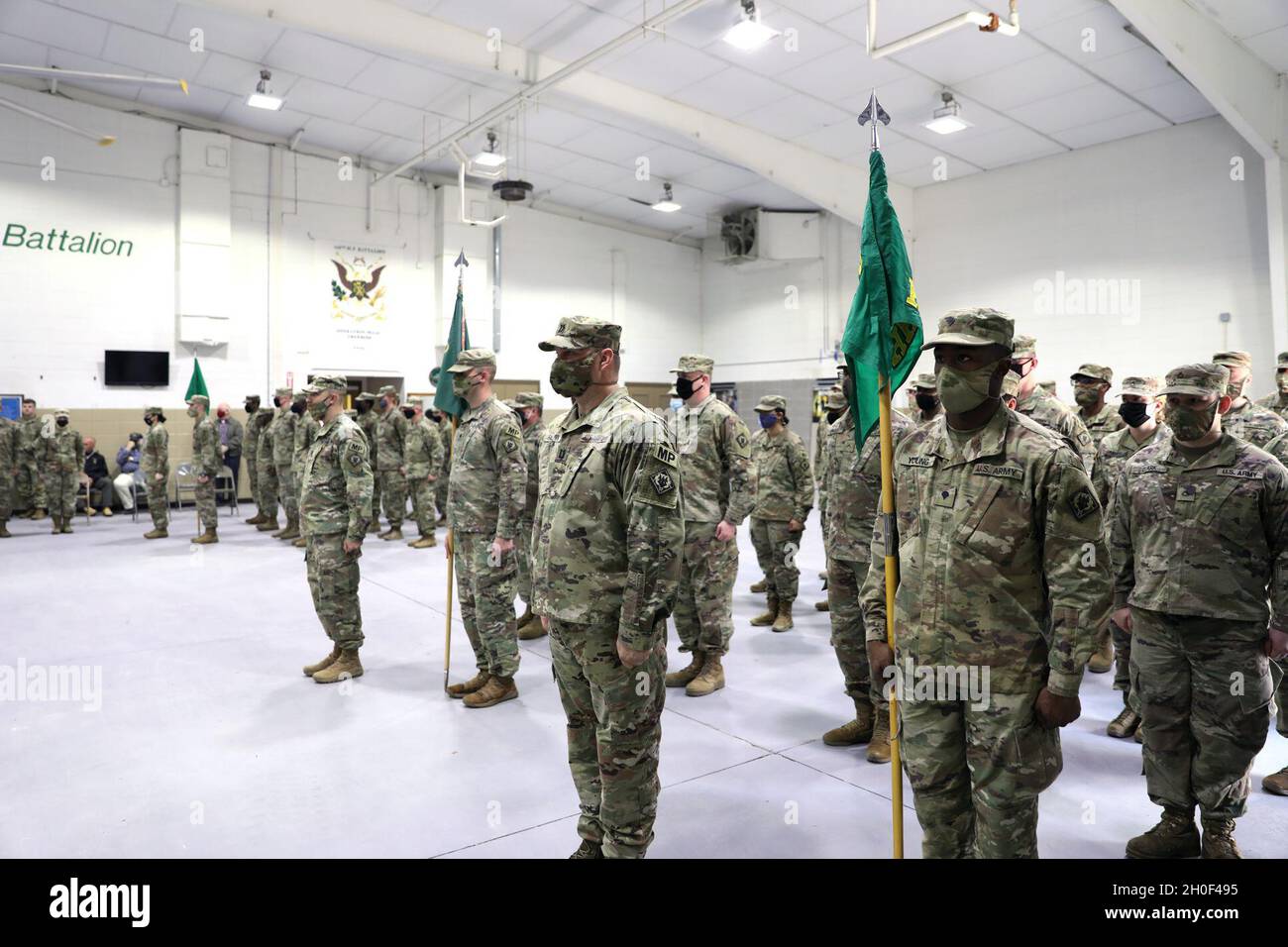 Soldiers with the 112th Military Police Battalion stand in formation ...