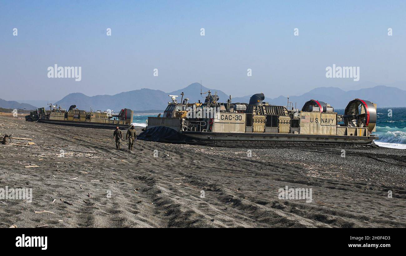 U.S. Navy Landing Craft Air Cushions (LCAC) land on the shores of ...