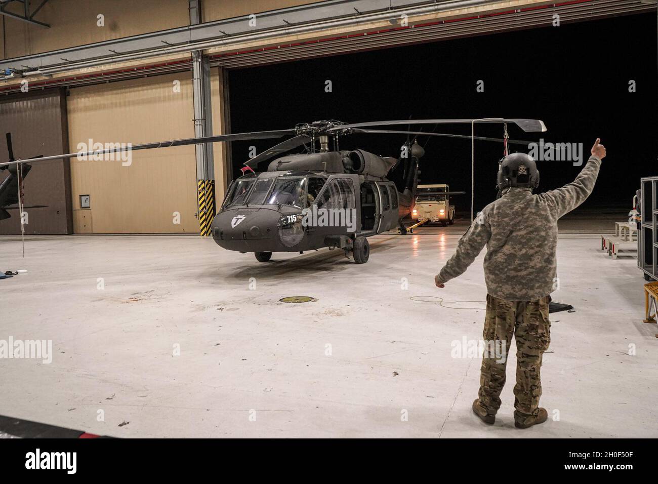 Soldiers from the Texas National Guard prepare a UH-60 Blackhawk to ...