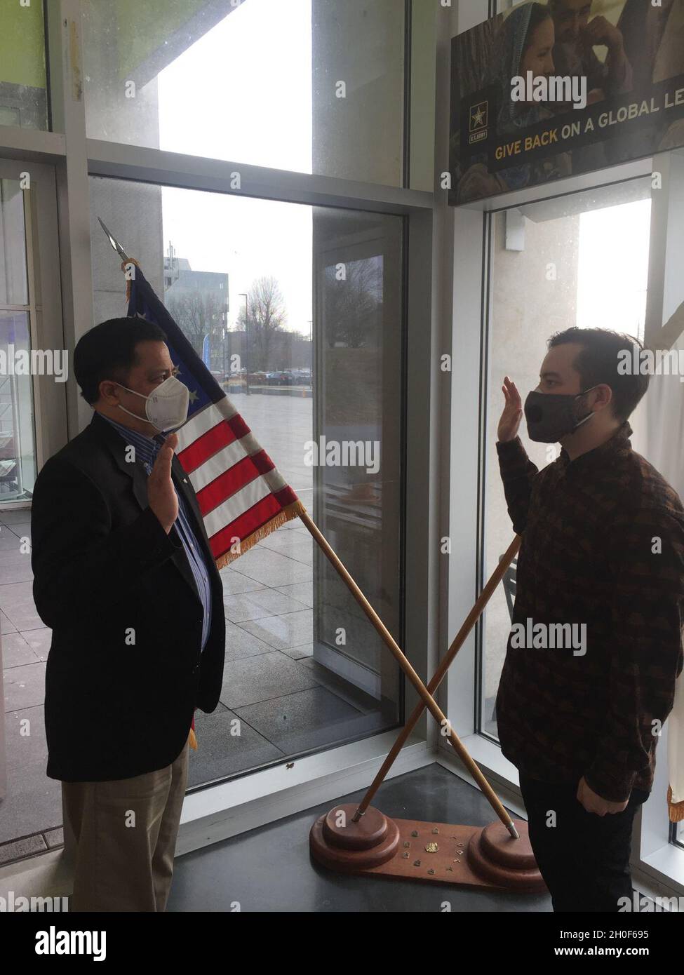 Retired Col. John Diaz gives the oath of enlistment to his son, Cameron ...