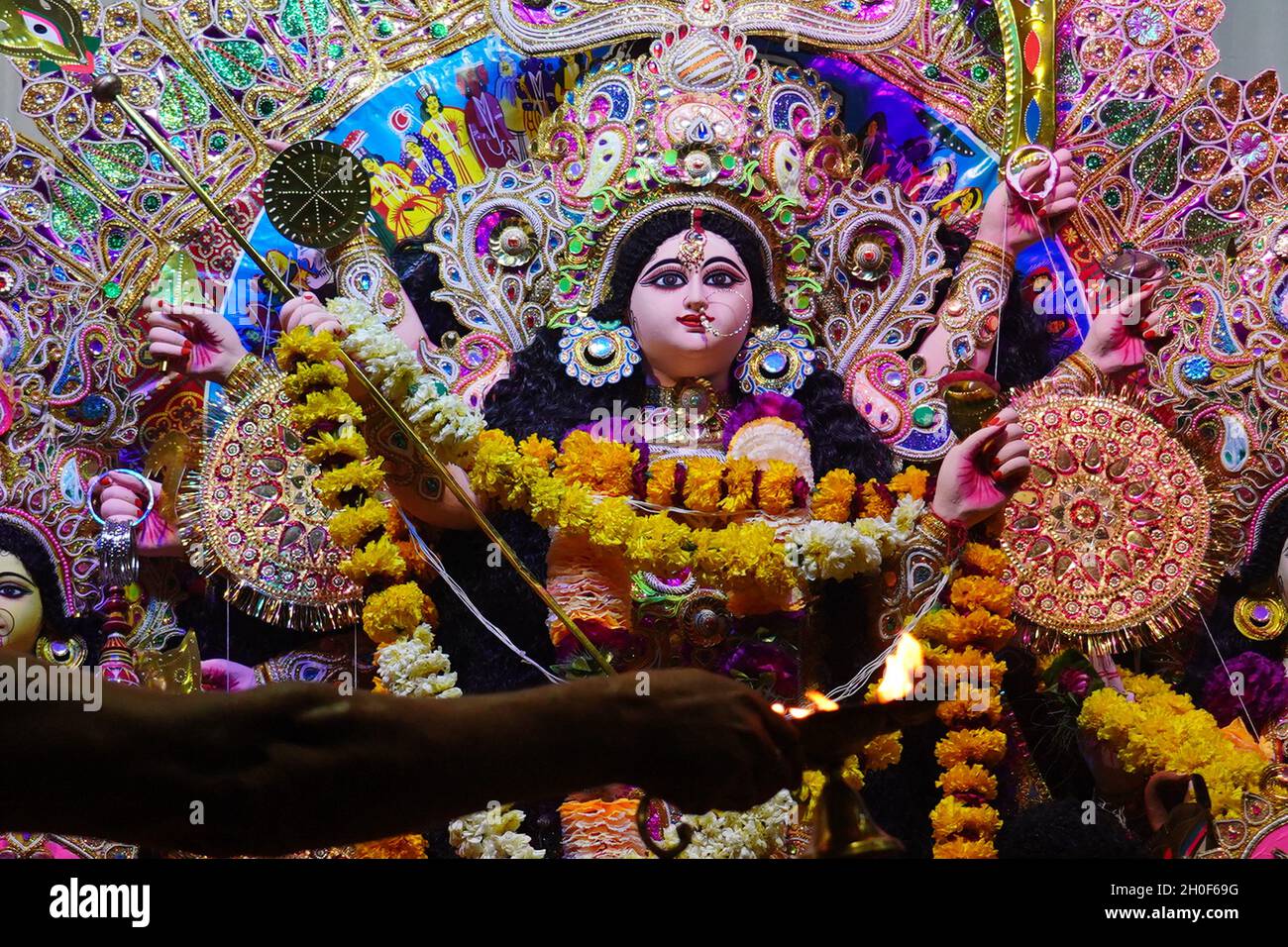 Indian People Perform Rituals in front of an idol of the Goddess Durga ...