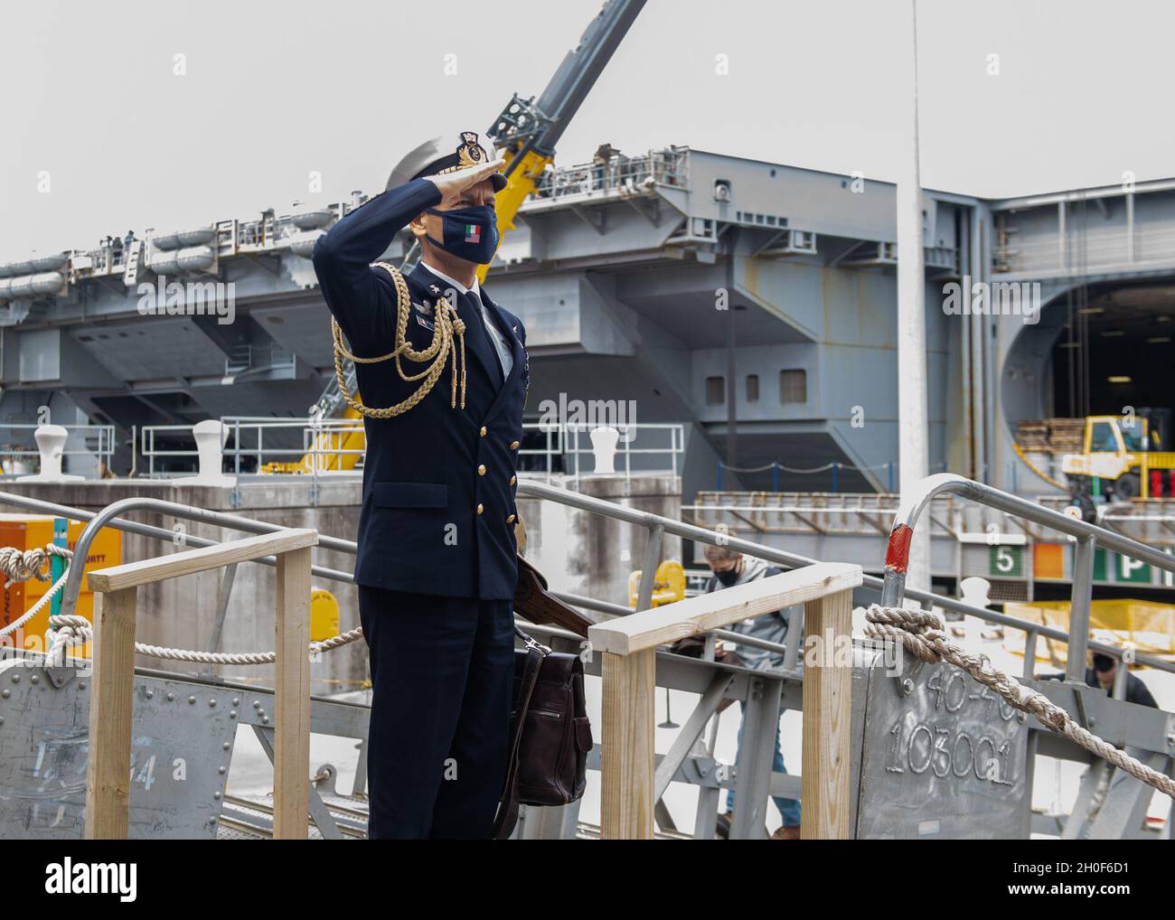 Italian Navy Capt. Gianfranco Vizzini, naval attaché, salutes on the ...
