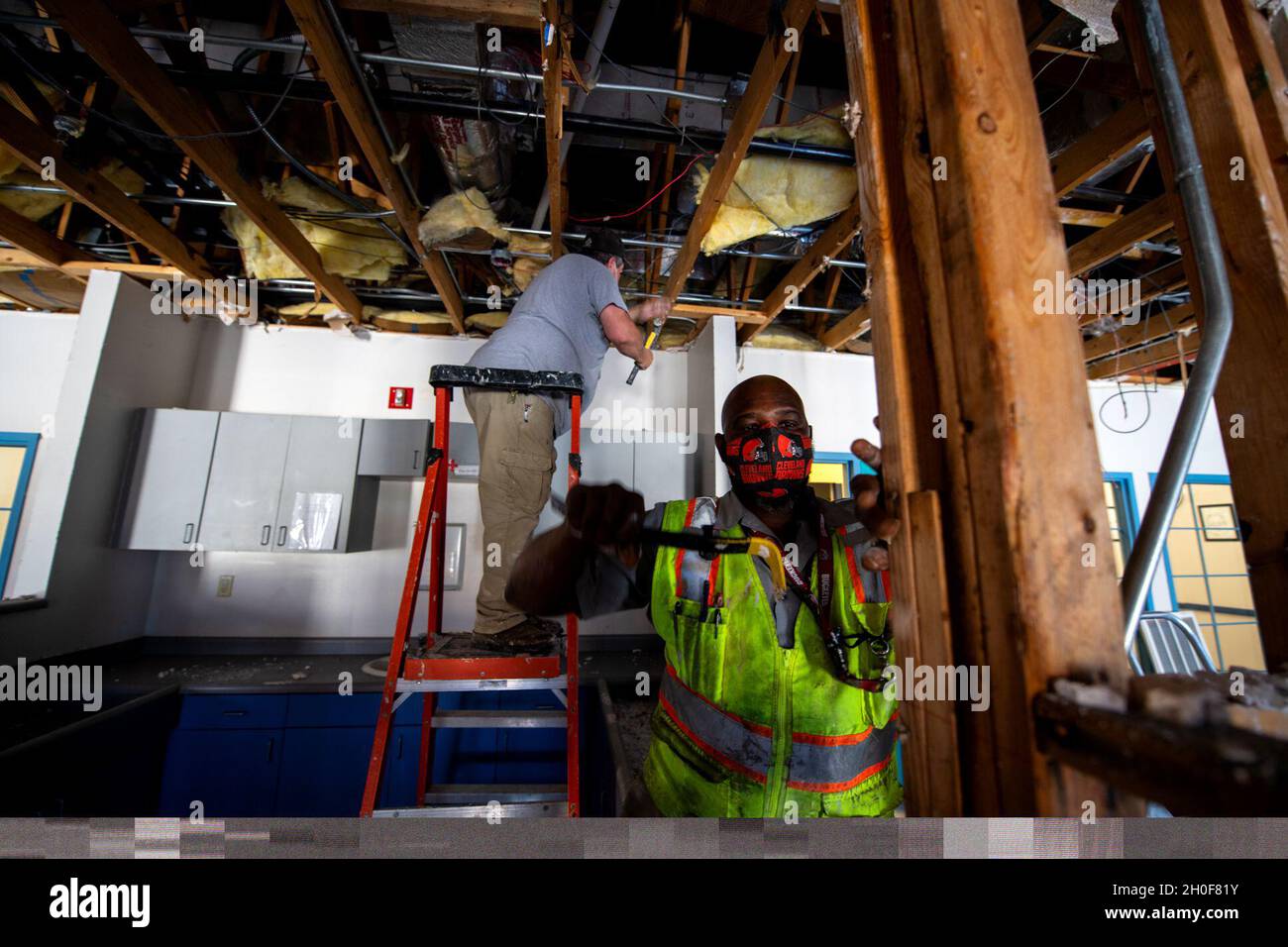 Troy Cook (back) and Samuel Burrell Sr., 502nd Civil Engineer Squadron ...