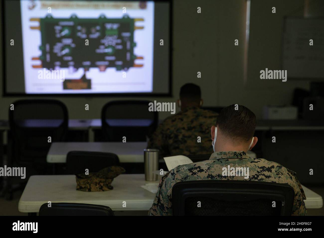 U.S. Marines with 10th Marine Regiment, 2d Marine Division, receive ...