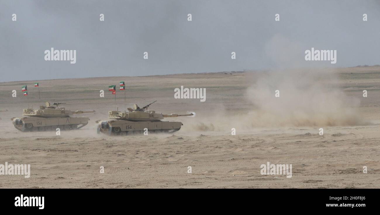 Kuwait Land Forces tanks fire rounds down range during a live-fire ...