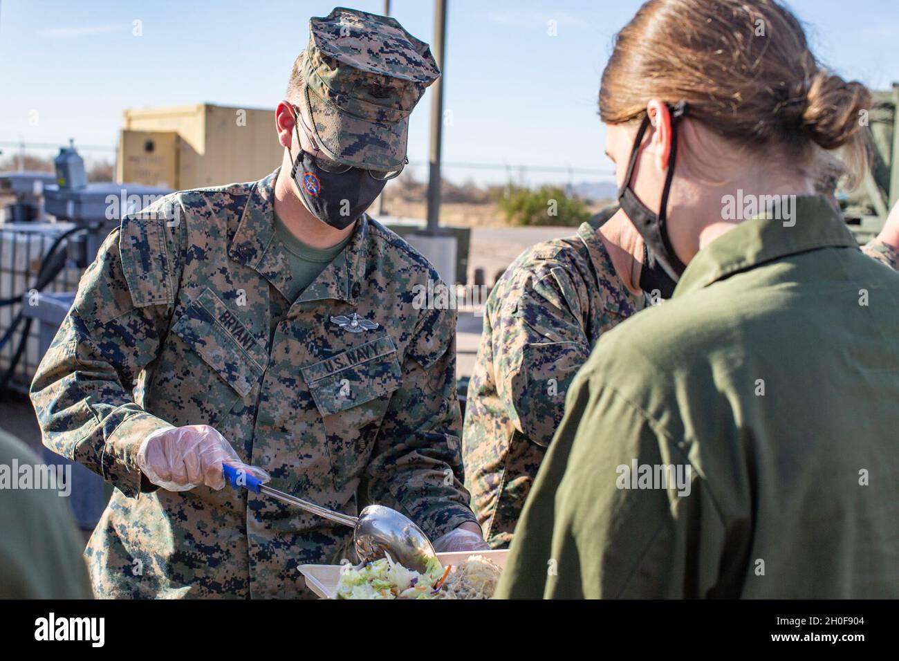 U.S. Navy Religious Program Specialist 3rd Class Kyle Bryant, left ...