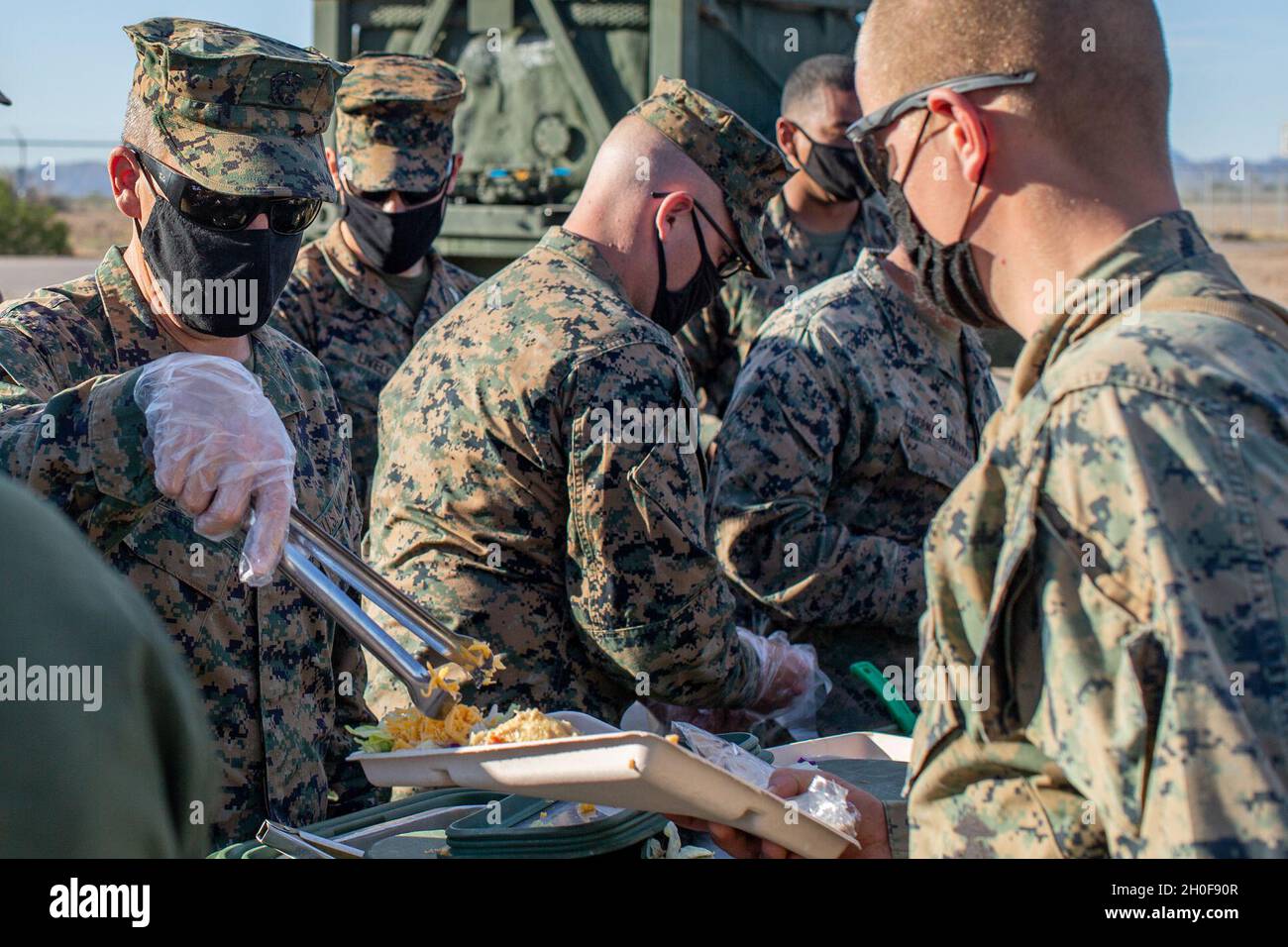 U.S. Navy Lt. Cmdr. Robert Fasnacht, left, the 11th Marine ...