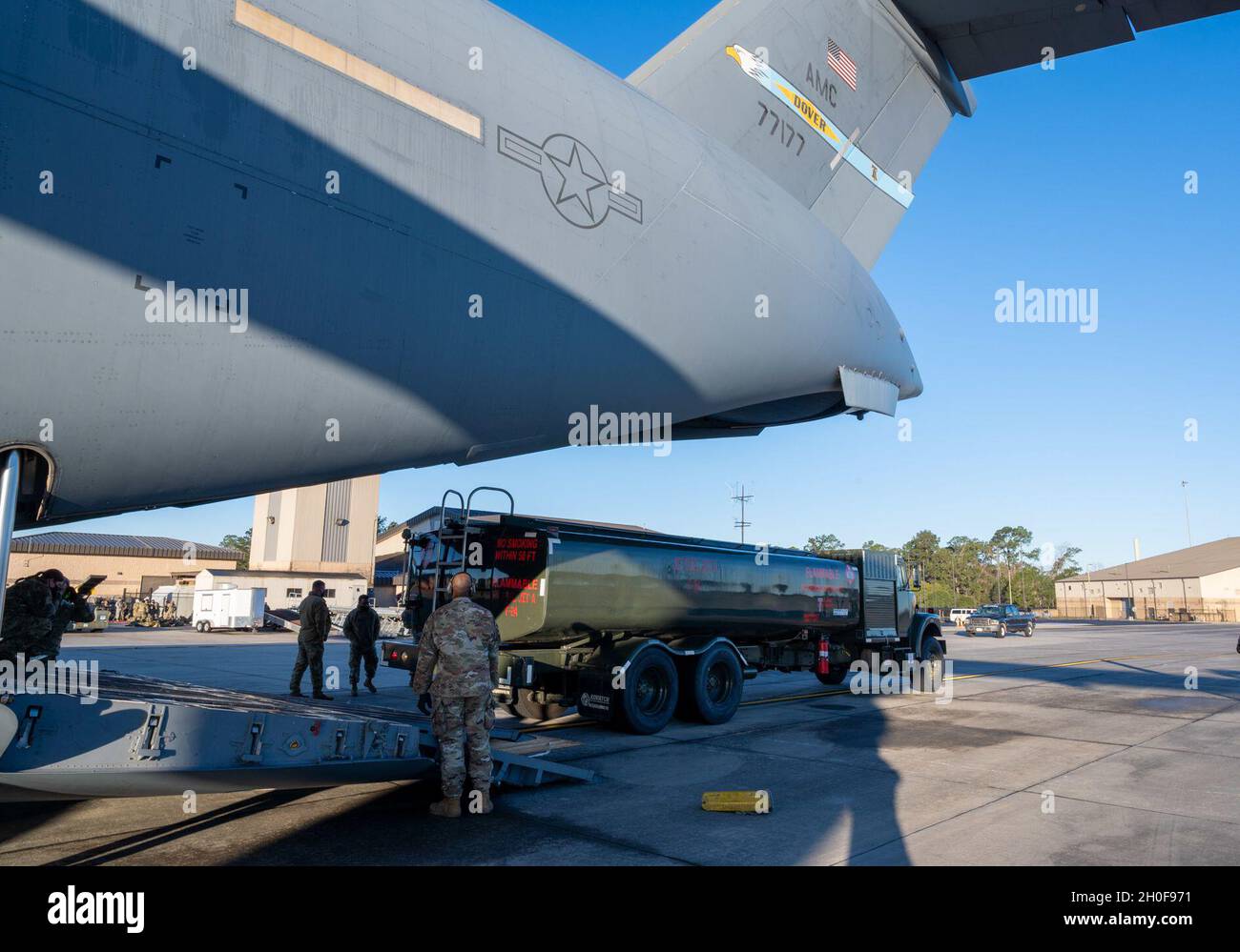 A fuel truck is loaded onto a Dover Air Force Base C-17 Globemaster III ...