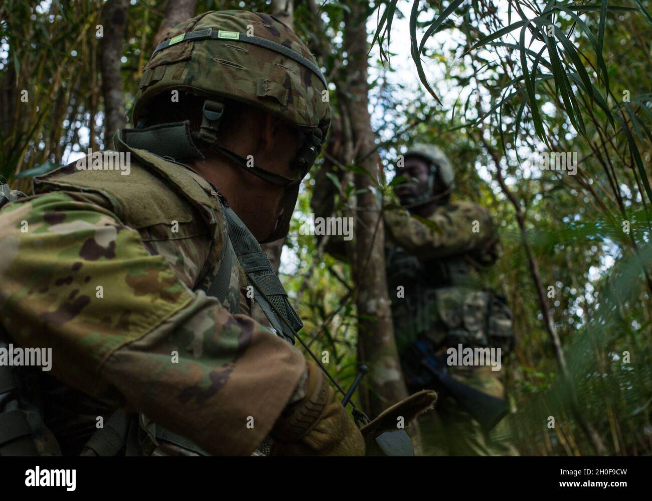 U.S. Army Spc. Matt Miley (left), a small arms and artillery repairer ...