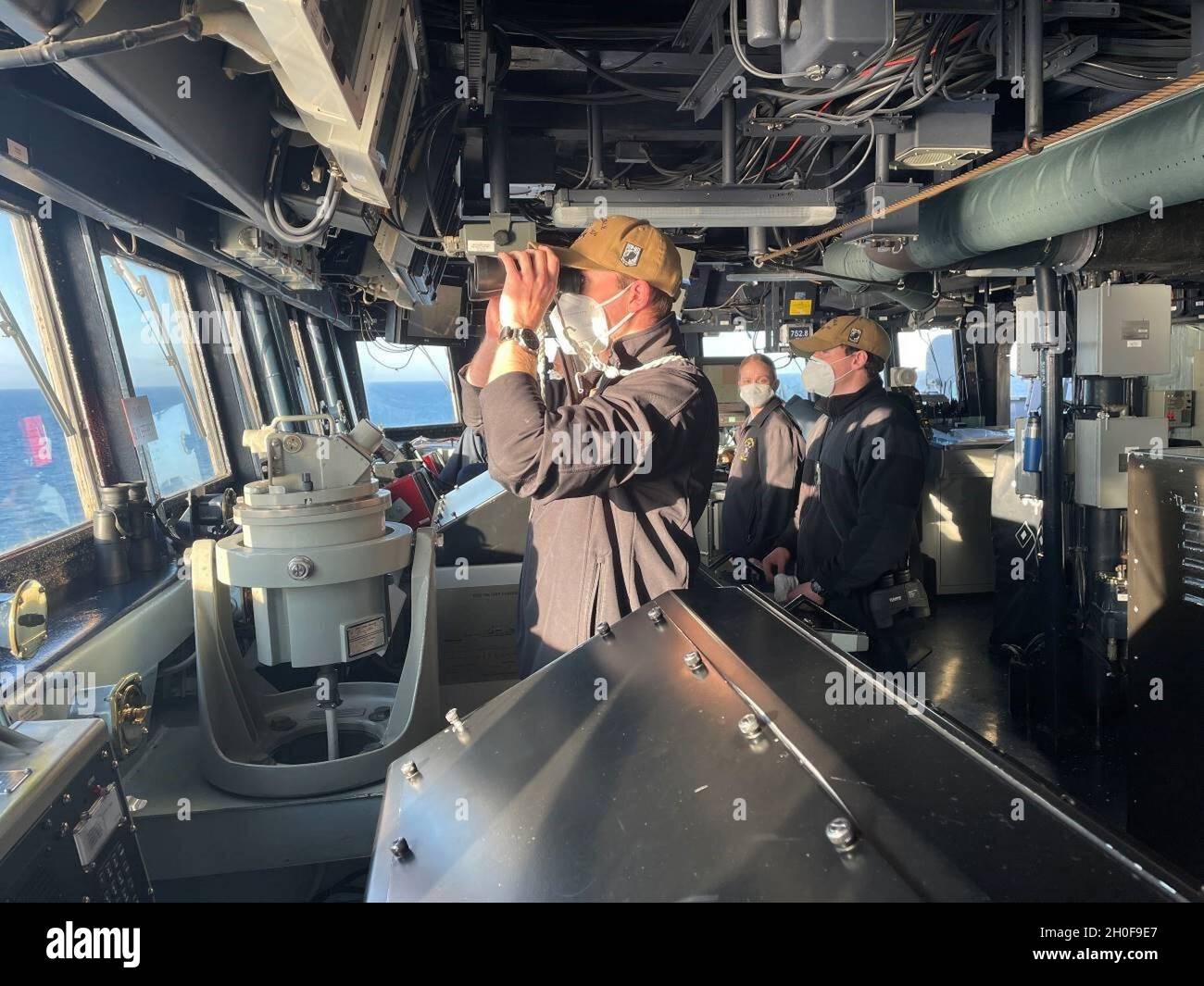 210223-N-QH580-1001 PACIFIC OCEAN (Feb. 23, 2021) Ens. Charles Raiford ...