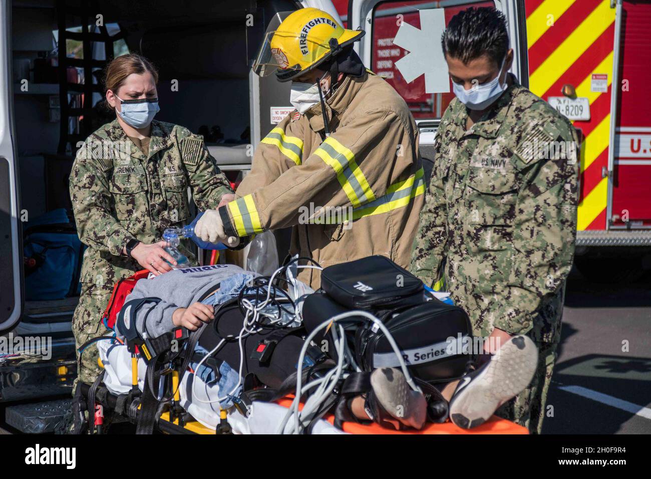 An emergency services medical team simulates life saving techniques on ...