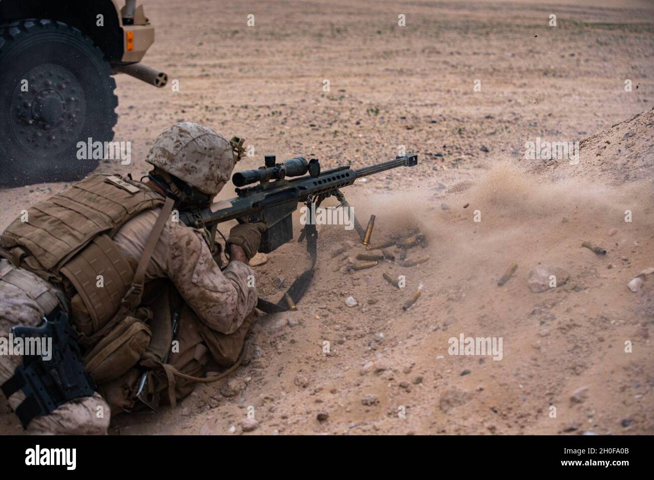 U.S. Marine Corps Cpl. Cody Blair, a scout sniper with Weapons Company, Battalion Landing Team 1 ...