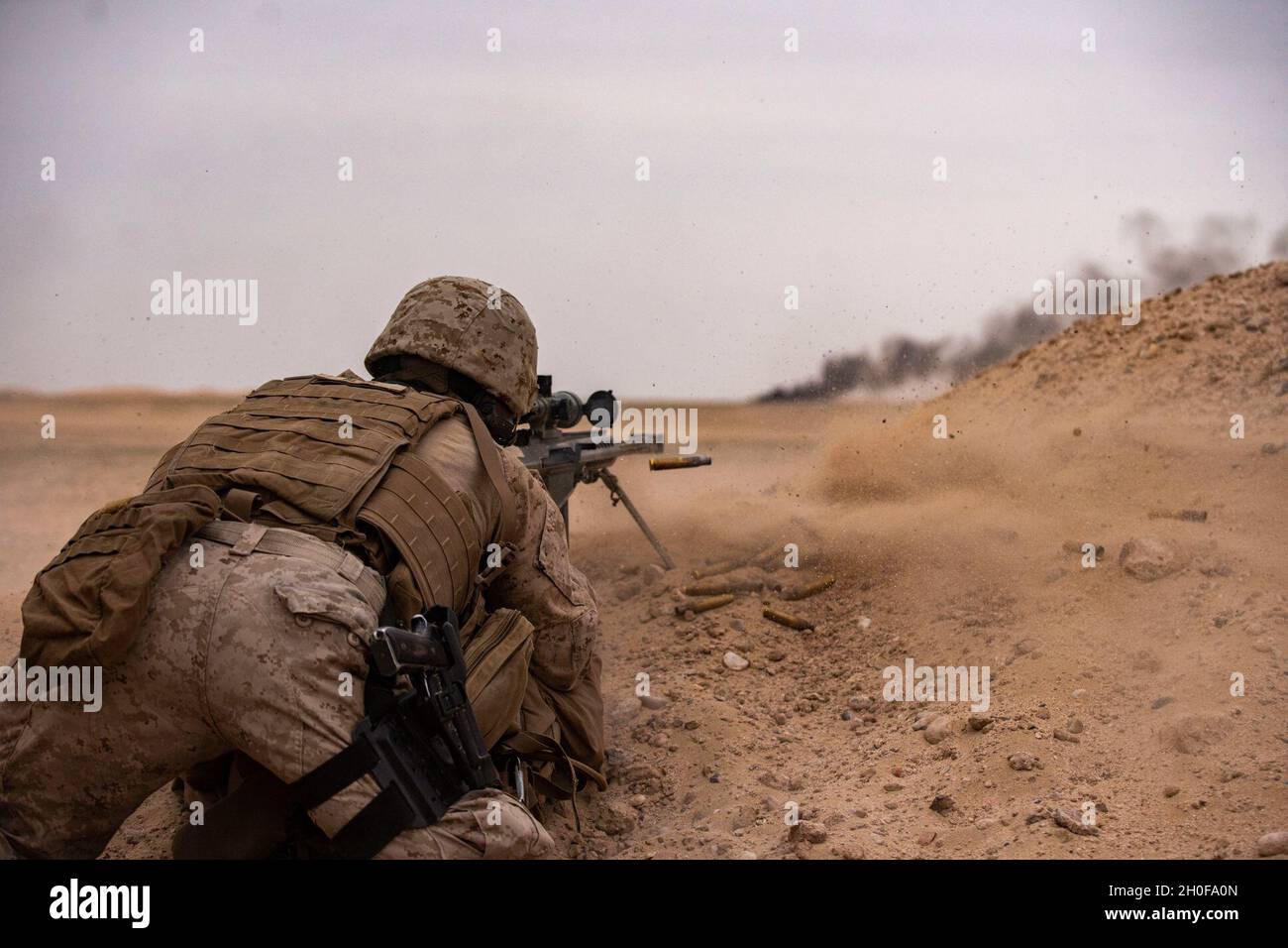 U.S. Marine Corps Cpl. Cody Blair, a scout sniper with Weapons Company, Battalion Landing Team 1 ...