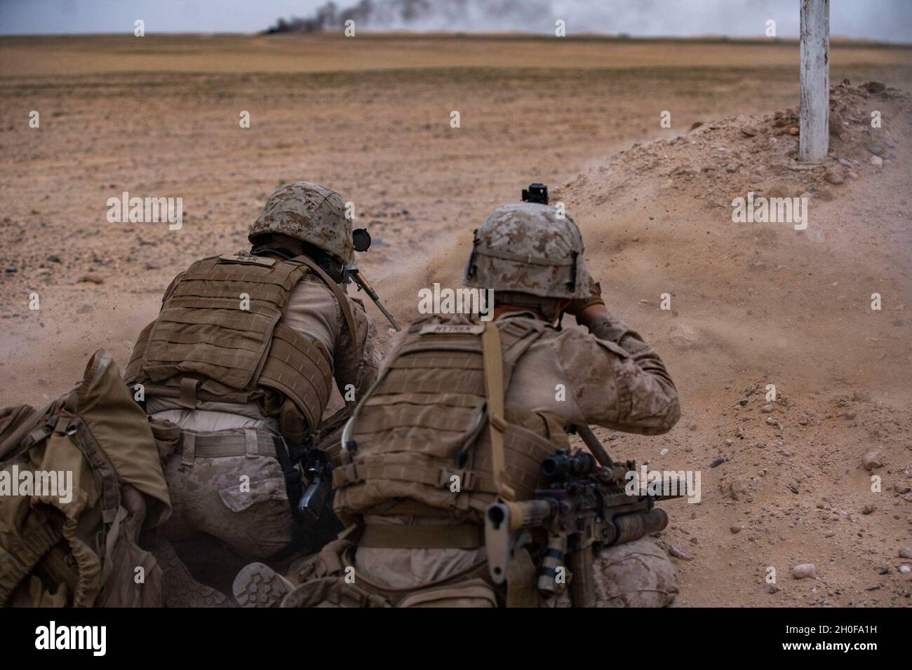 U.S. Marine Corps Cpl. Cody Blair, left, a scout sniper with Weapons Company, Battalion Landing ...