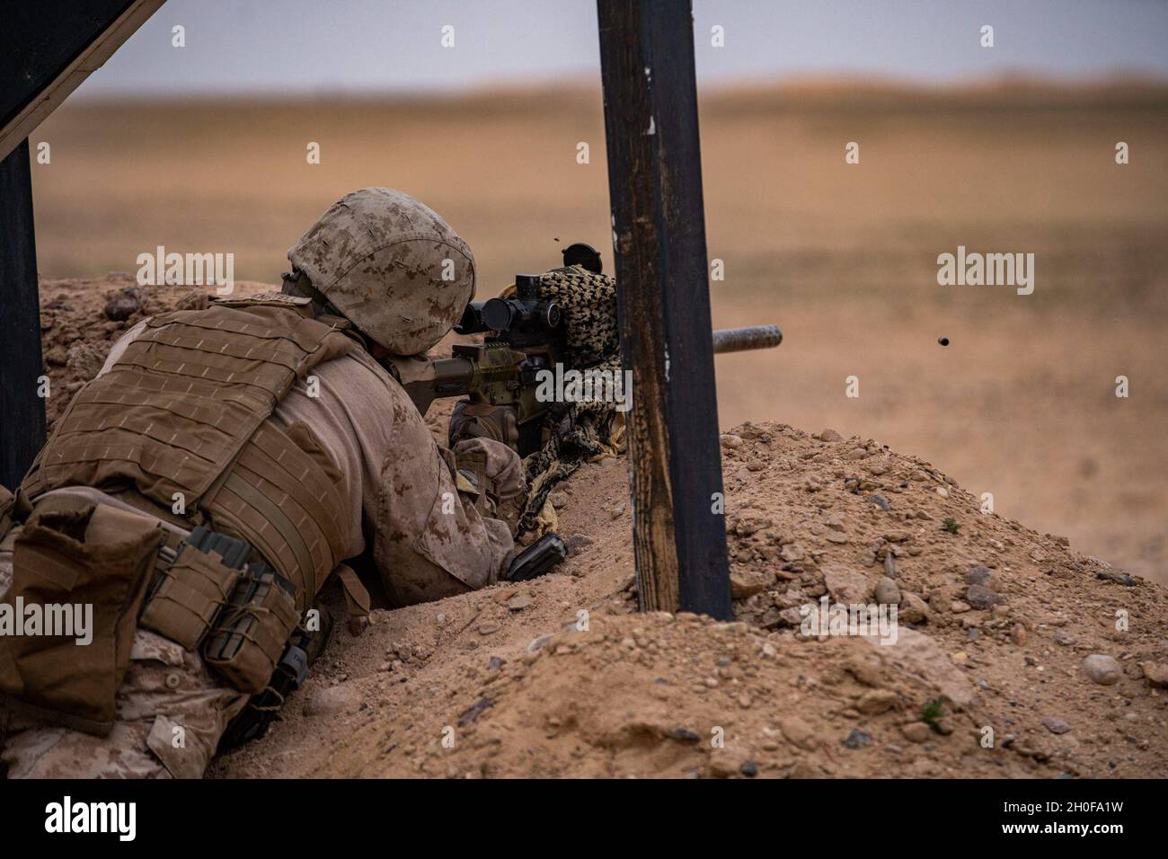 U.S. Marine Corps Cpl. Michael Helpenstell, a scout sniper with Weapons Company, Battalion ...