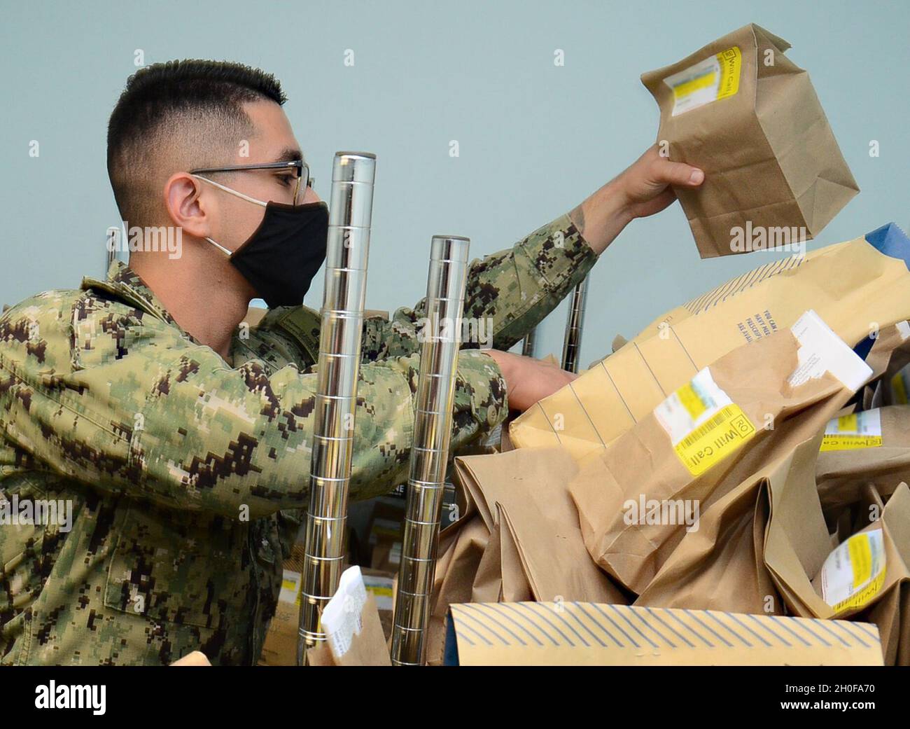 Hospitalman Benny Castro Flores, a pharmacy technician assigned to Navy ...