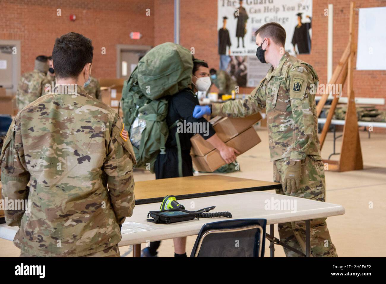 One Soldier wishes luck to another, both members of 1-102nd Infantry ...