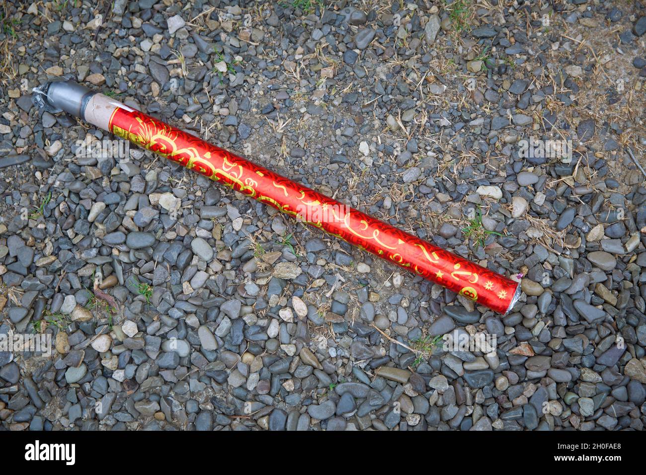 Background of gravel round stones . The exploded firecracker was thrown ...