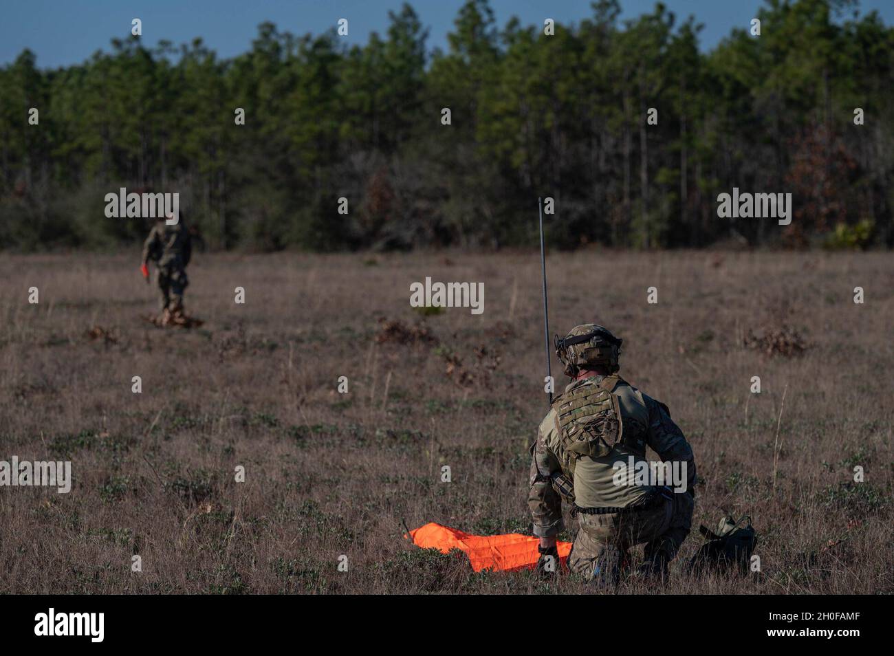 U.S. Air Force Special Tactics operators position VS-17 signal panels ...