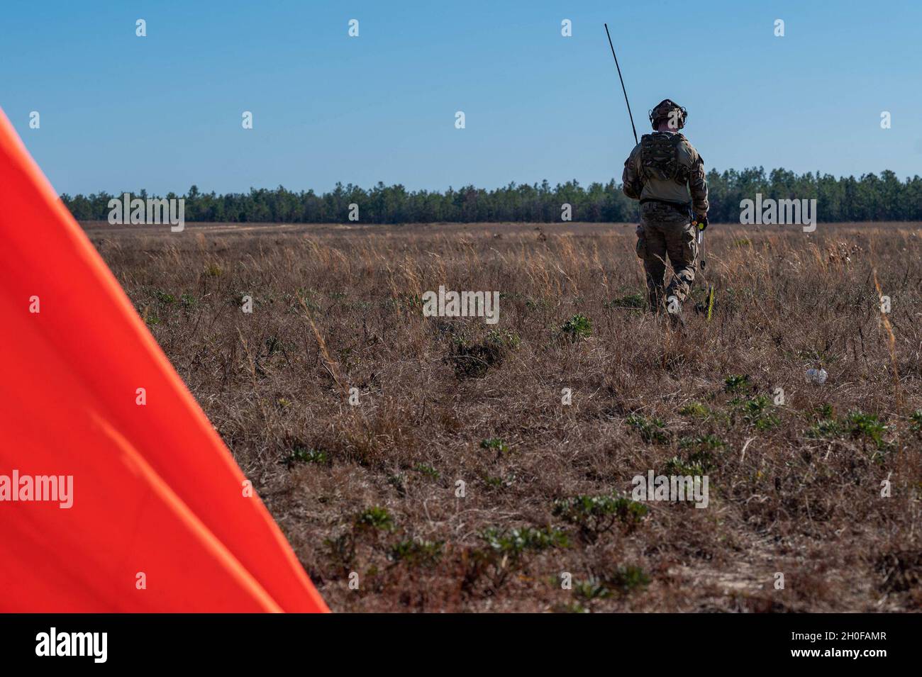 A U.S. Air Force Special Tactics operator measures the distance between ...