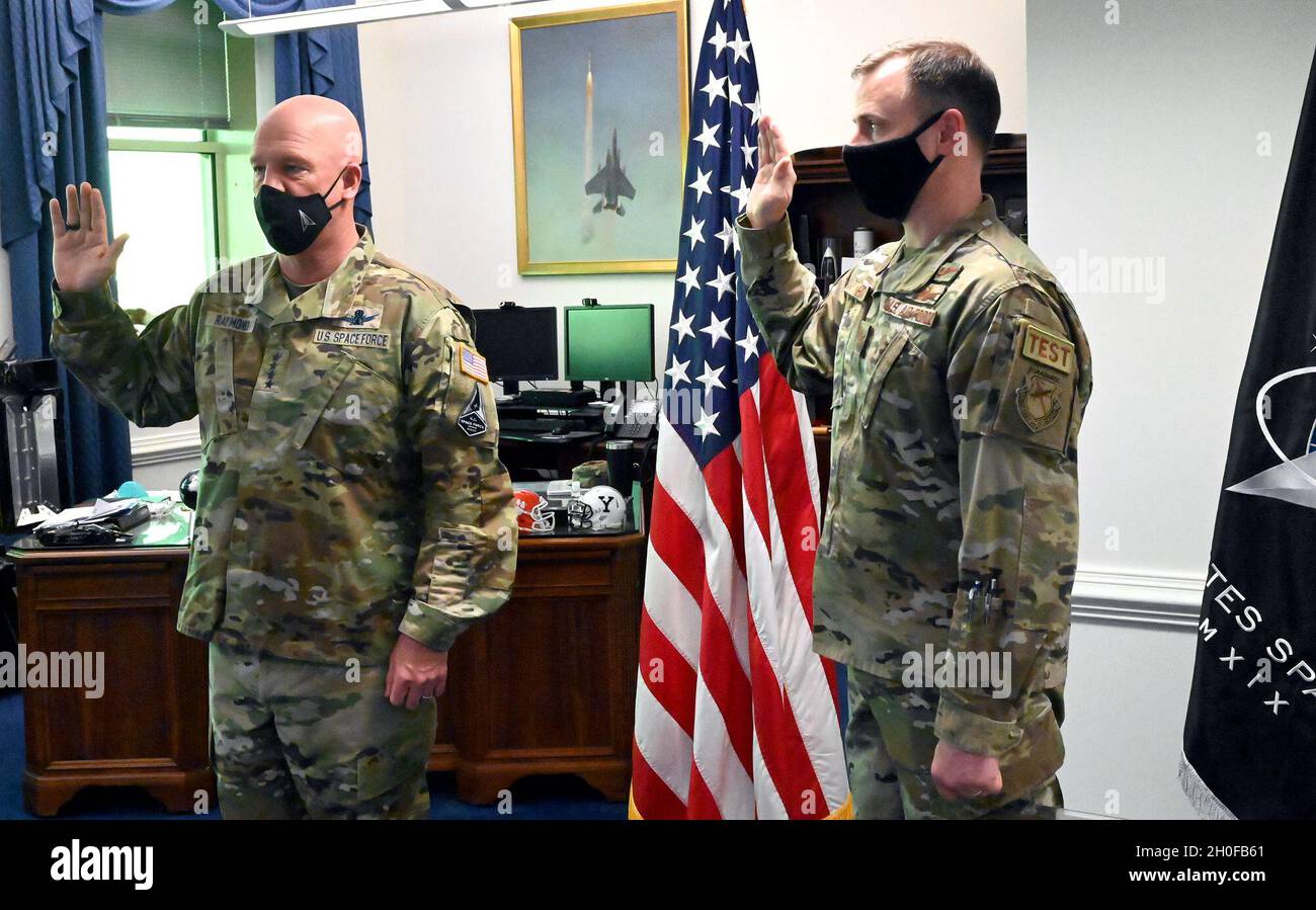Chief of Space Operations Gen. John W. Raymond, left, administers the ...