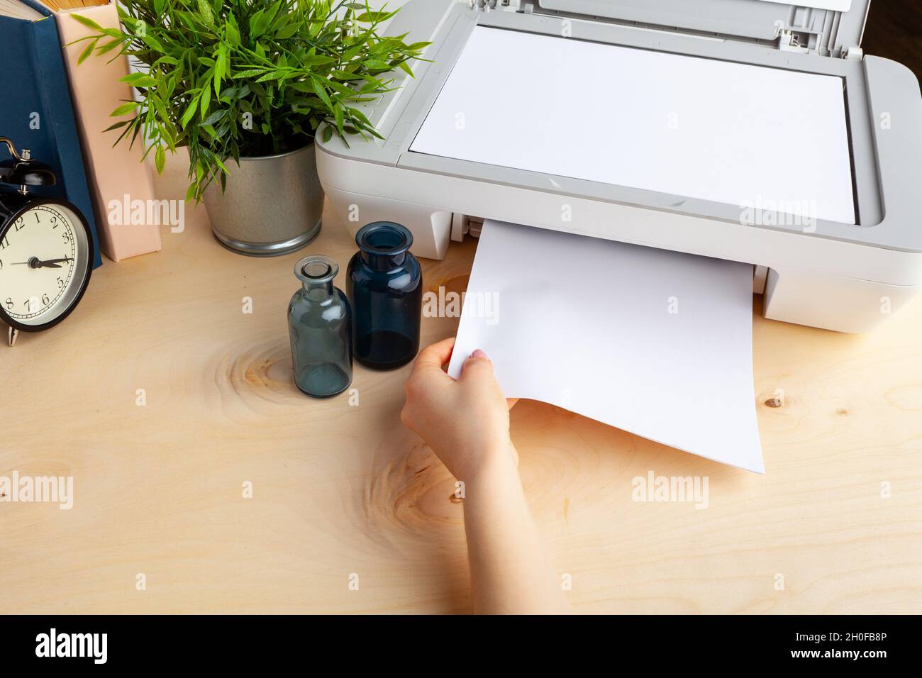 Close up of woman using a printer machine Stock Photo - Alamy