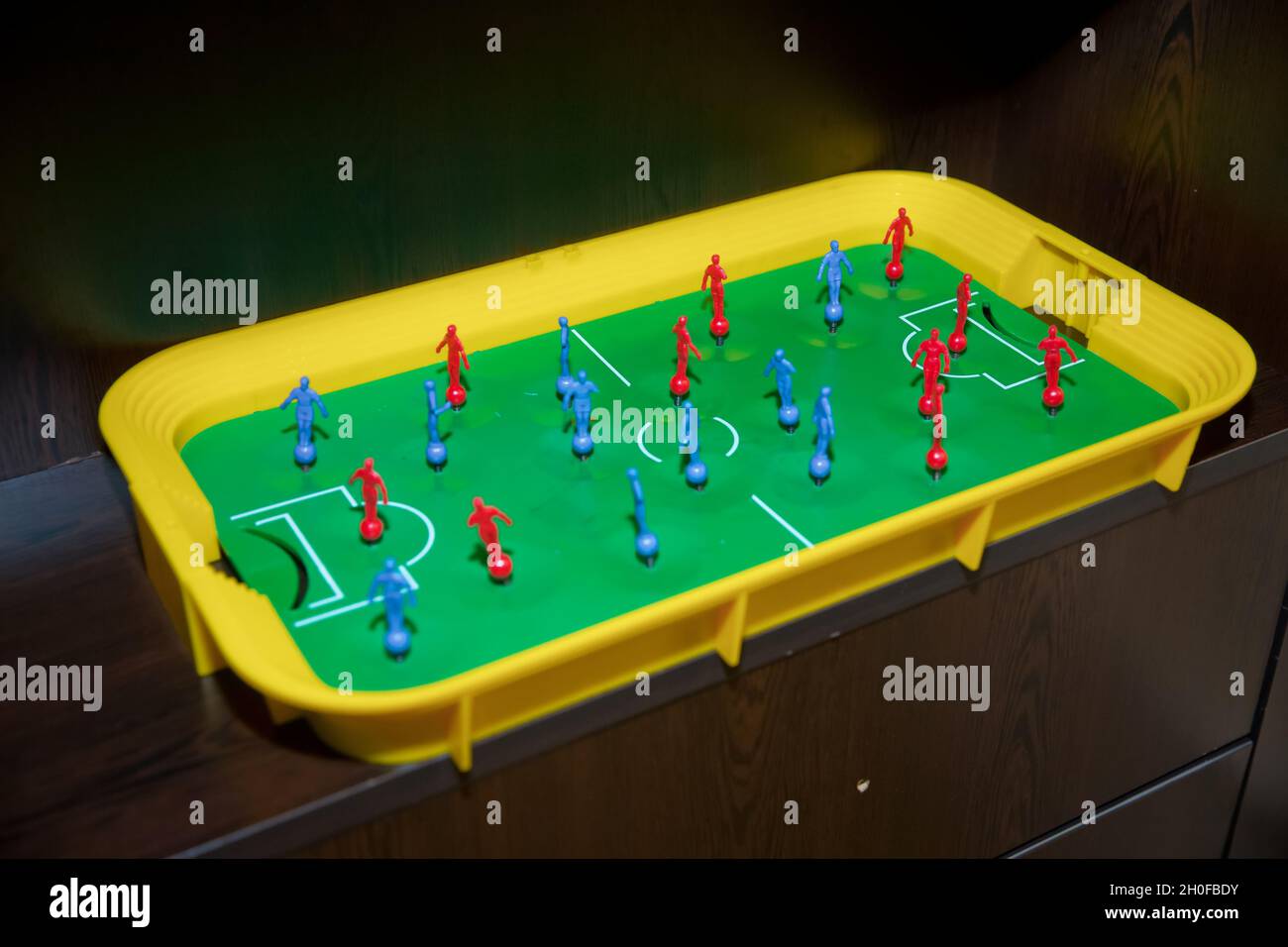 Top view table soccer with red blue players and a ball. Foosball table ...