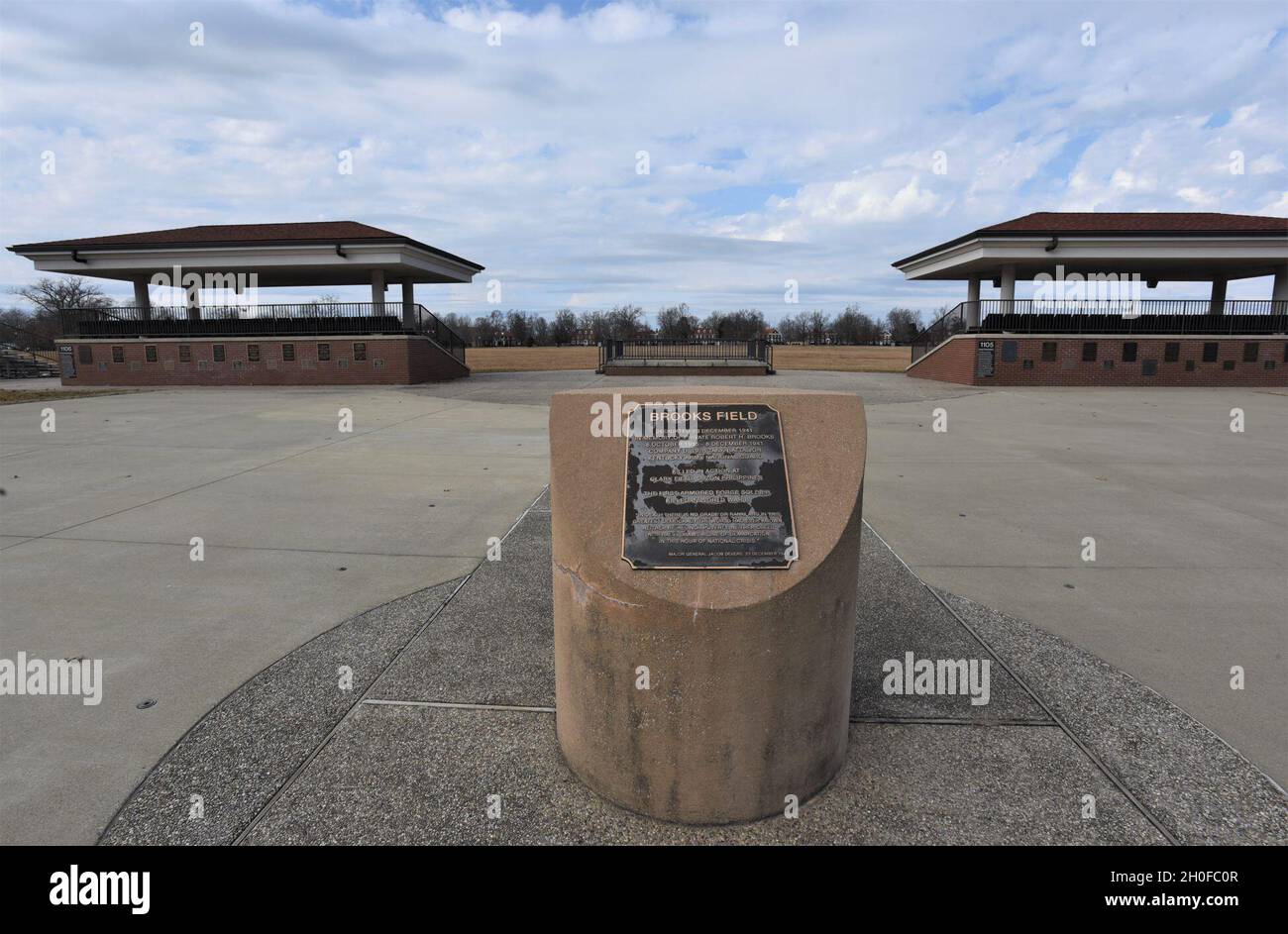 A plaque stands at the central entrance to Brooks Field as a tribute to ...