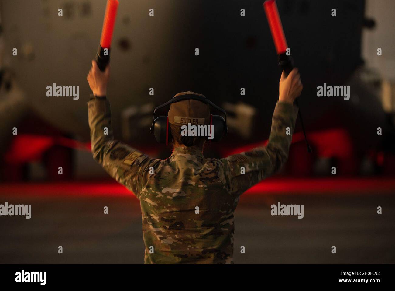 An Airman directs a C-5 Galaxy on the ground during exercise Patriot ...