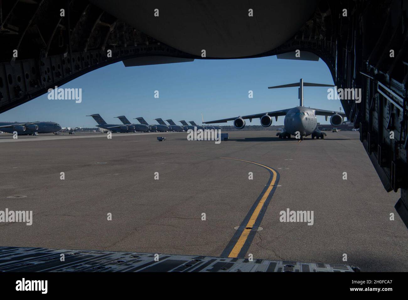 C-17 Globemaster IIIs sit on the flightline at Joint Base Charleston ...