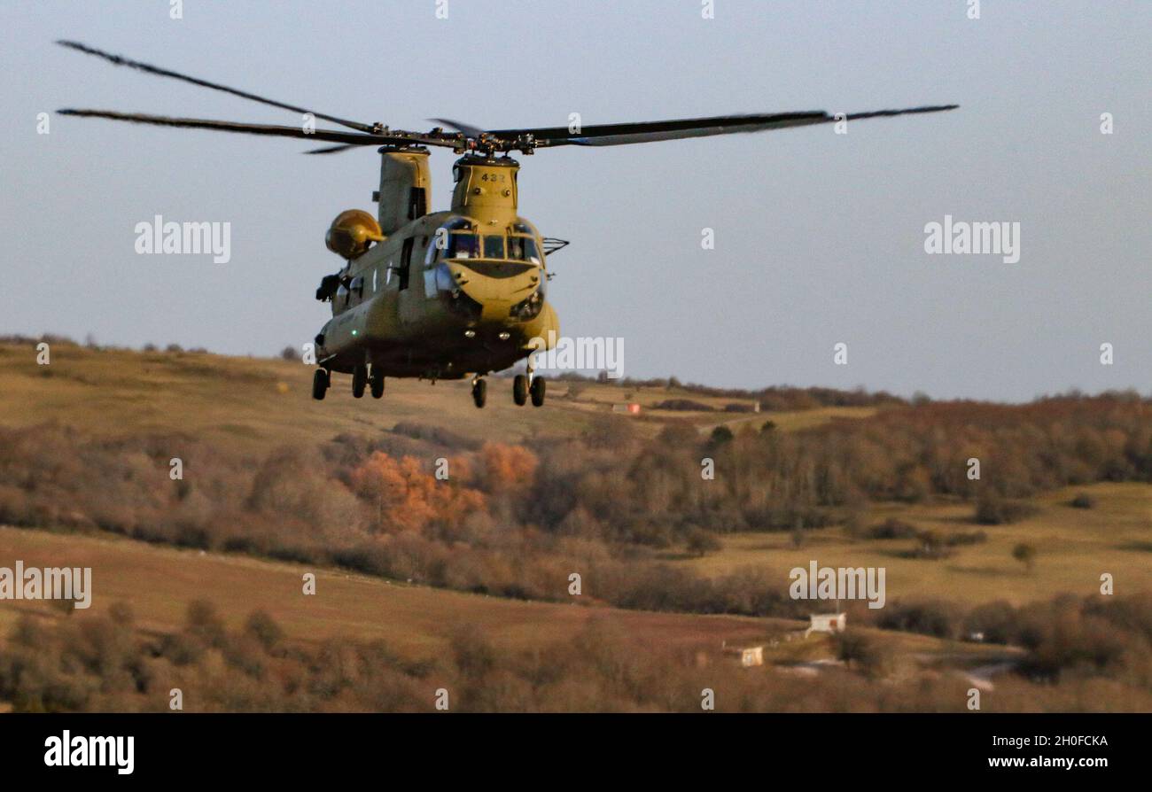 A CH-47 Chinook helicopter flies over Baumholder Training Area ...