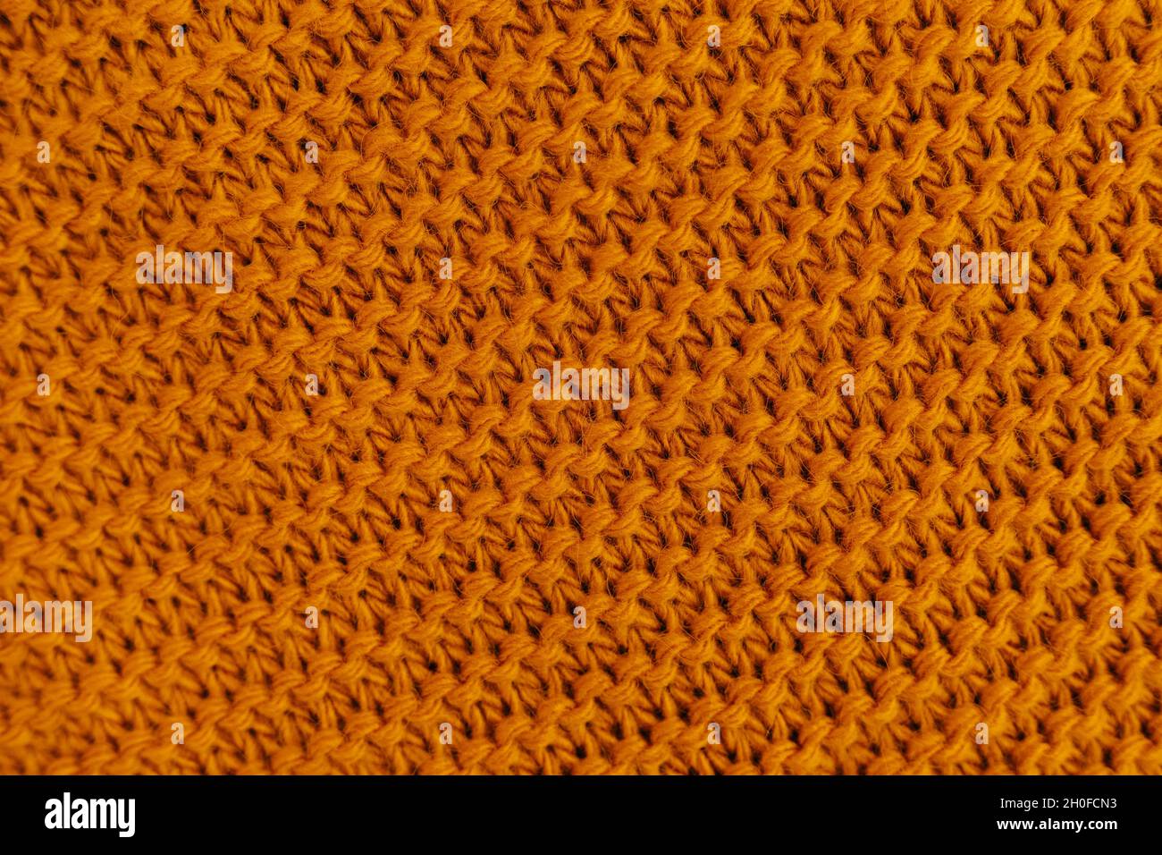 Orange autumn knitting wool texture background Stock Photo - Alamy