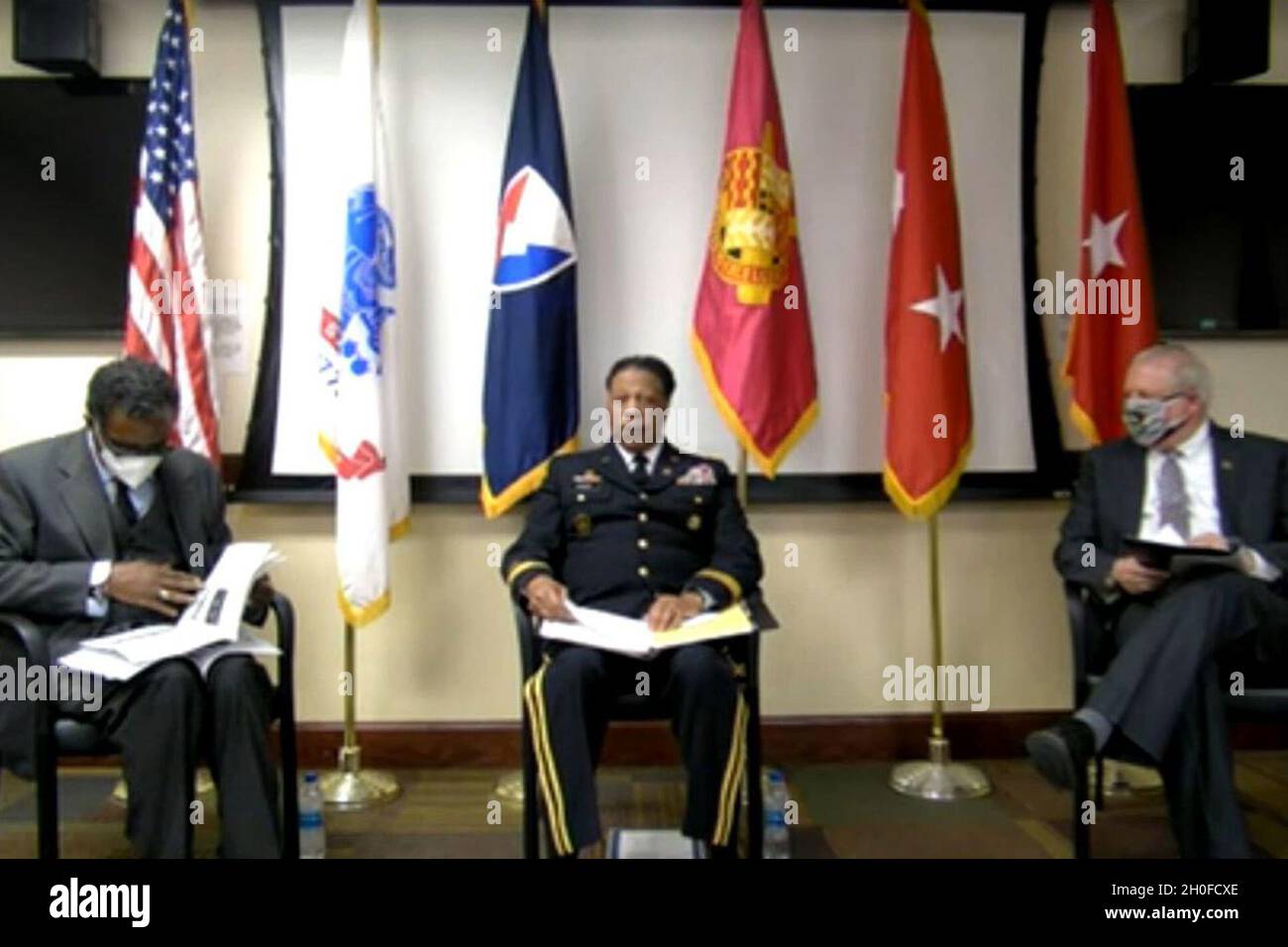 Maj. Gen. (Ret) Adolph McQueen Jr. (center), guest speaker, talks with ...