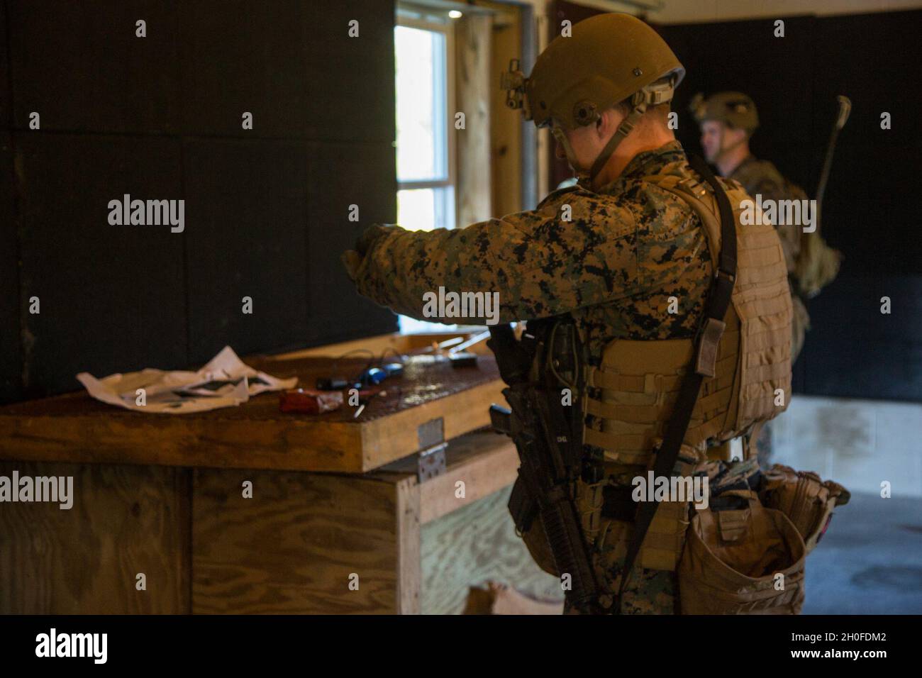 An Explosive Ordinance Disposal Marine with Marine Raider Regiment ...