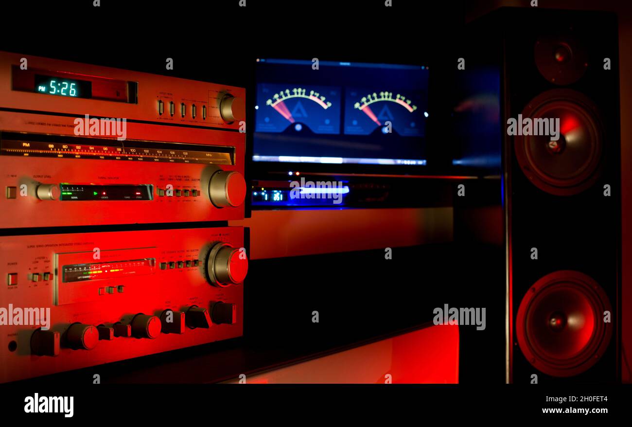 Speakers and amplifier on cozy red lights in dark background. Home ...