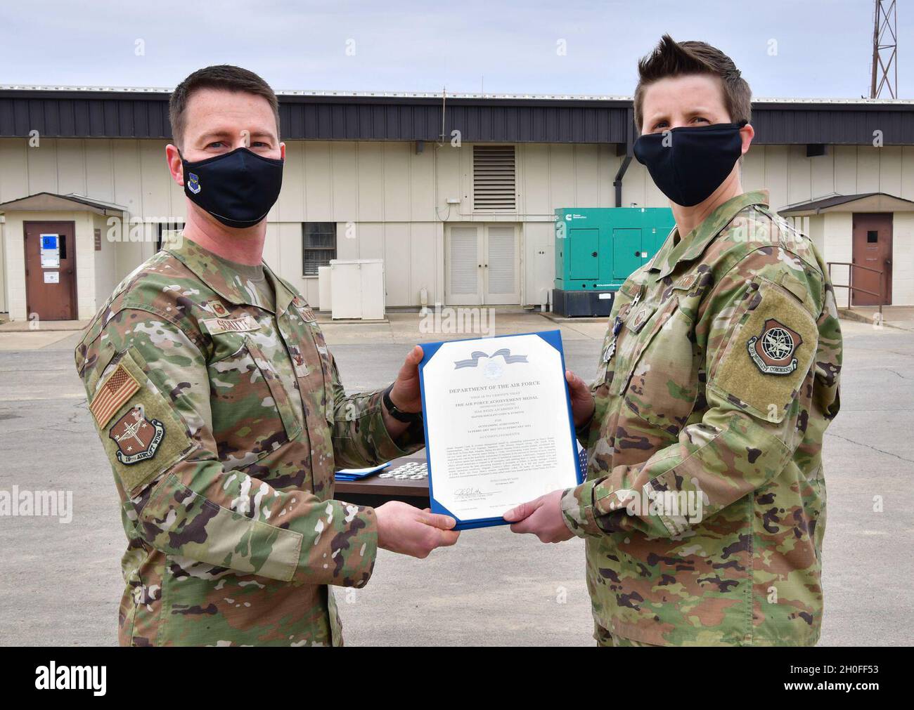 Col. John Schutte, 19th Airlift Wing commander, left, presents Master ...