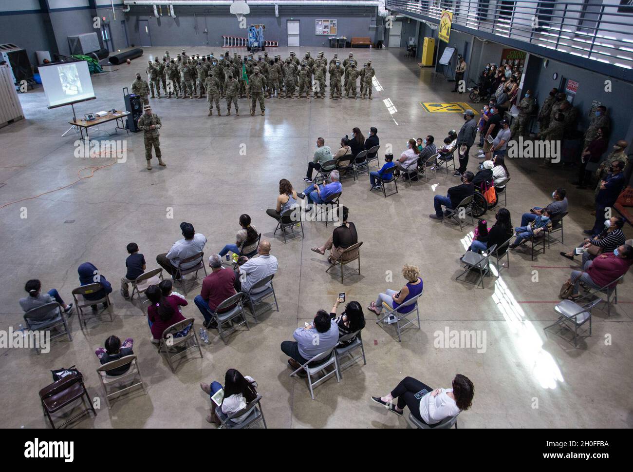 U.S. Army 1st Sgt. Martin Rivera addresses family members during a ...