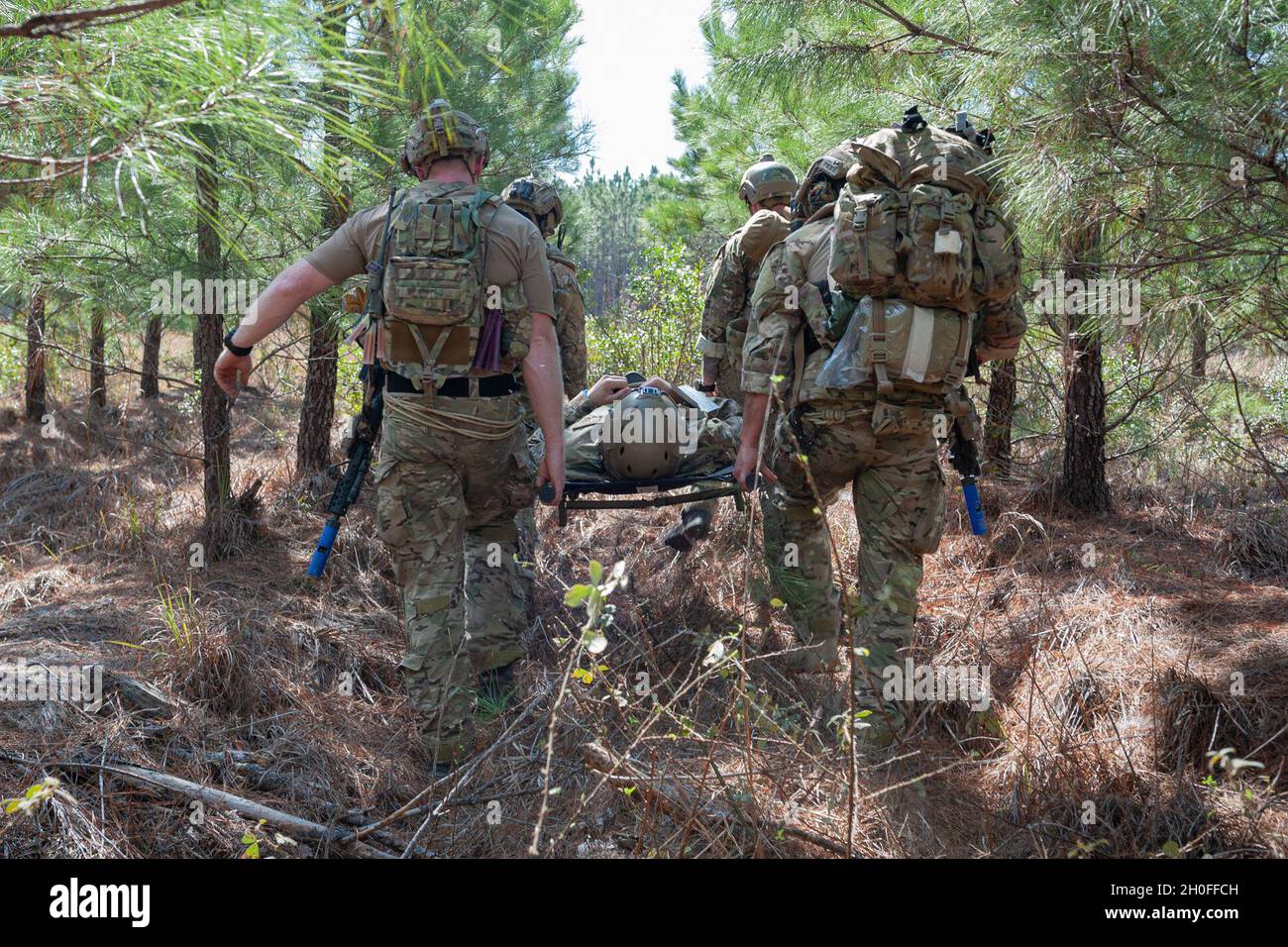 Pararescue Airmen assigned to the 38th Rescue Squadron carry a wounded ...