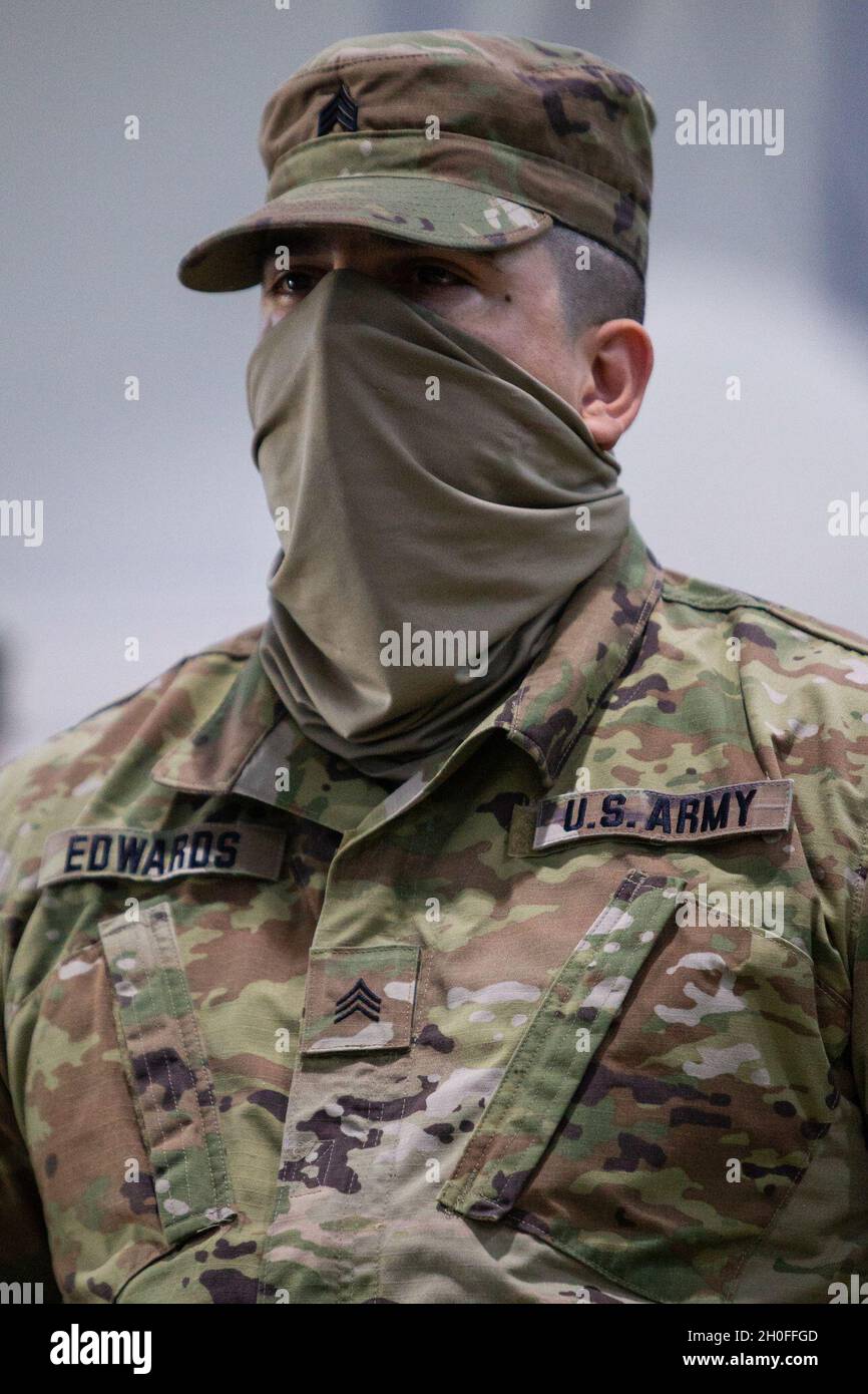 U.S. Army Sgt. Edwards stands in formation during a departure ceremony ...