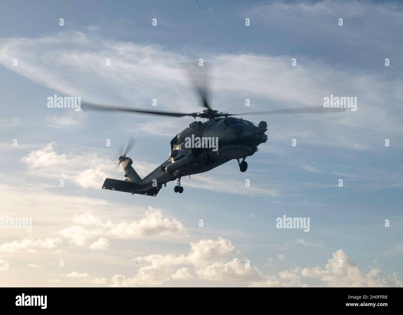 PACIFIC OCEAN (Feb. 25, 2021) An MH-60R Sea Hawk, assigned to the “Wolf ...