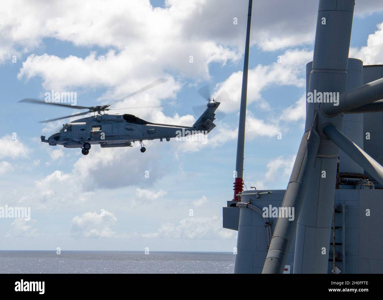 PACIFIC OCEAN (Feb. 25, 2021) An MH-60R Sea Hawk, assigned to the “Wolf ...