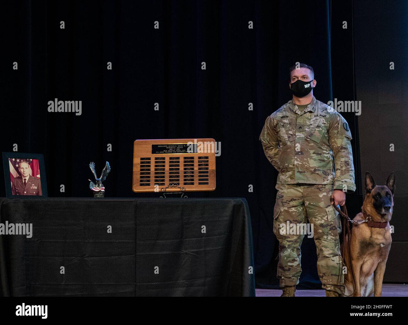 Sgt. Aaron Vinson, a military dog handler assigned to the 3rd Military ...
