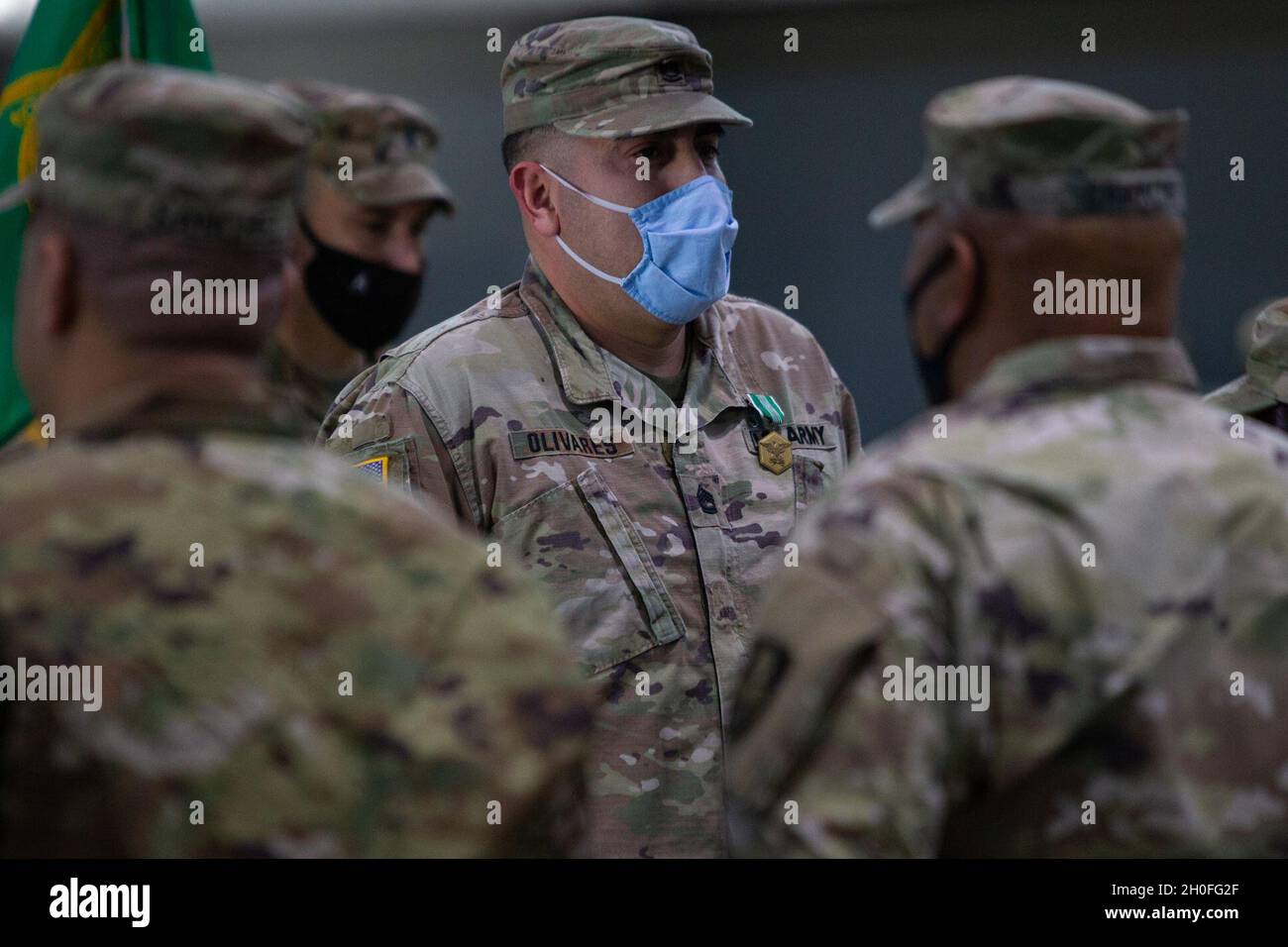 U.S. Army Sgt. 1st Class Nicasio Olivares is presented with an Army ...