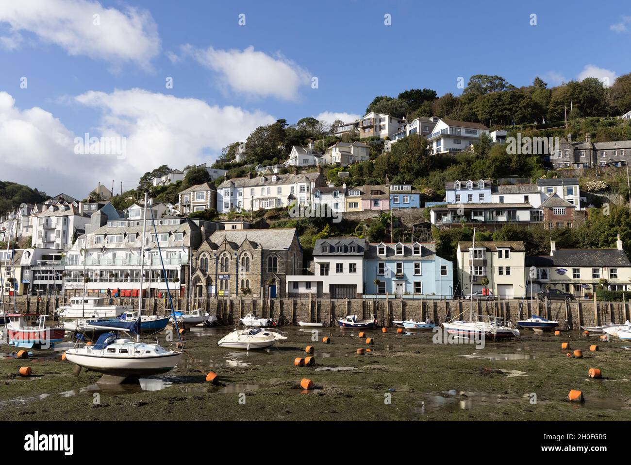 Looe Cornwall; boats in Looe harbour on the River Looe at low tide in ...