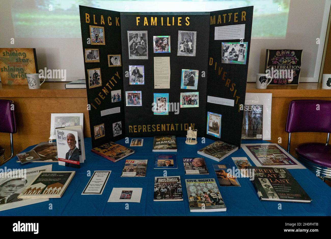 Books and photos portraying African American achievements are included ...