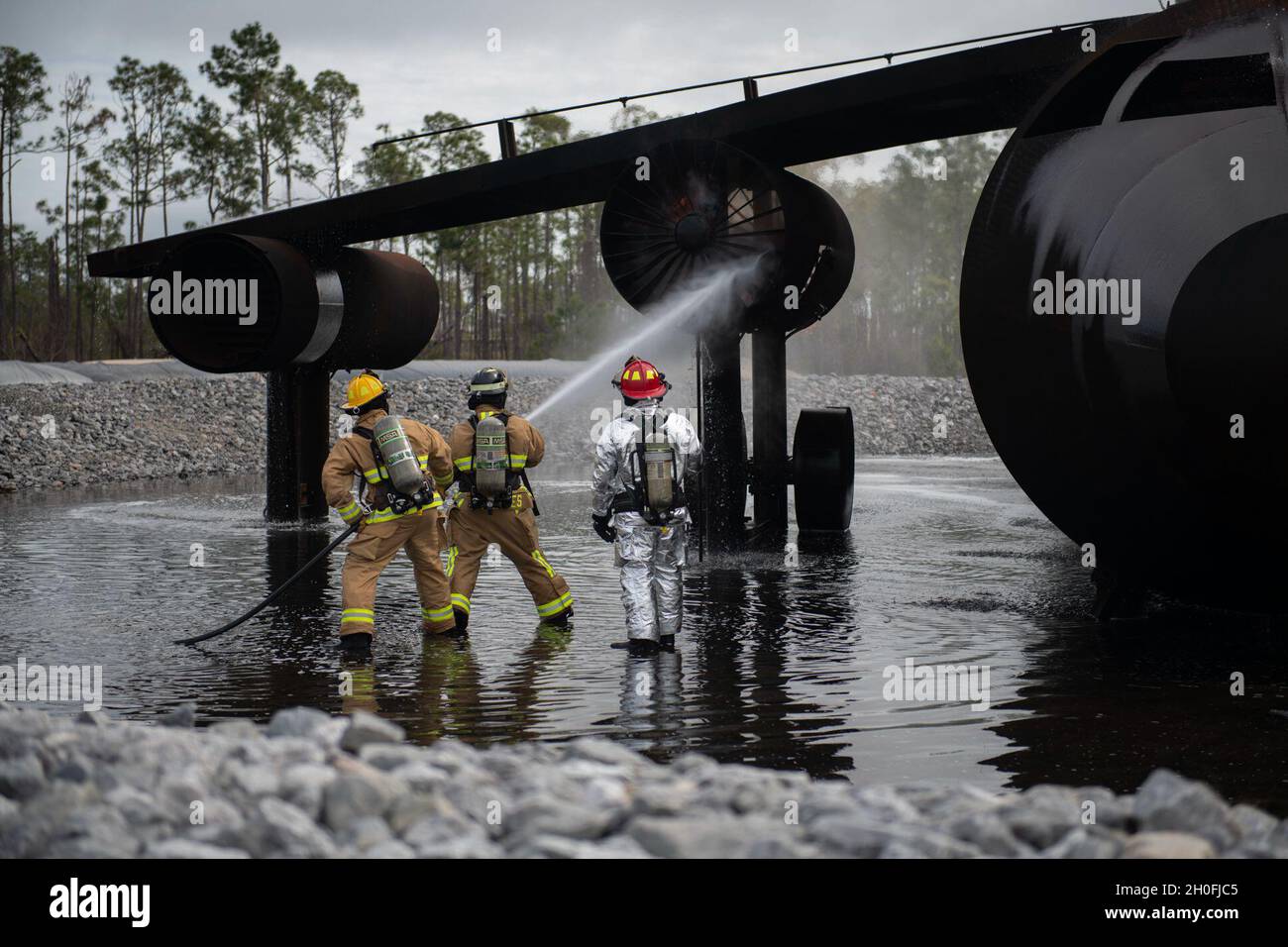 U.S. Air Force Airmen participate in a live fire training simulation at ...
