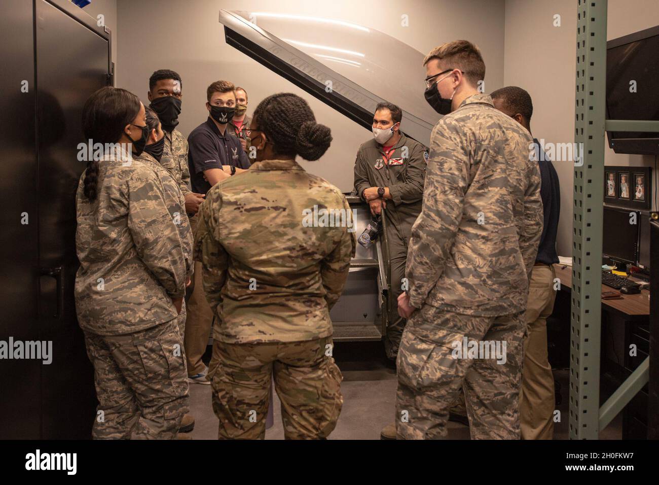 A 187th Fighter Wing pilot briefs AFROTC cadets on the F-16 simulator ...